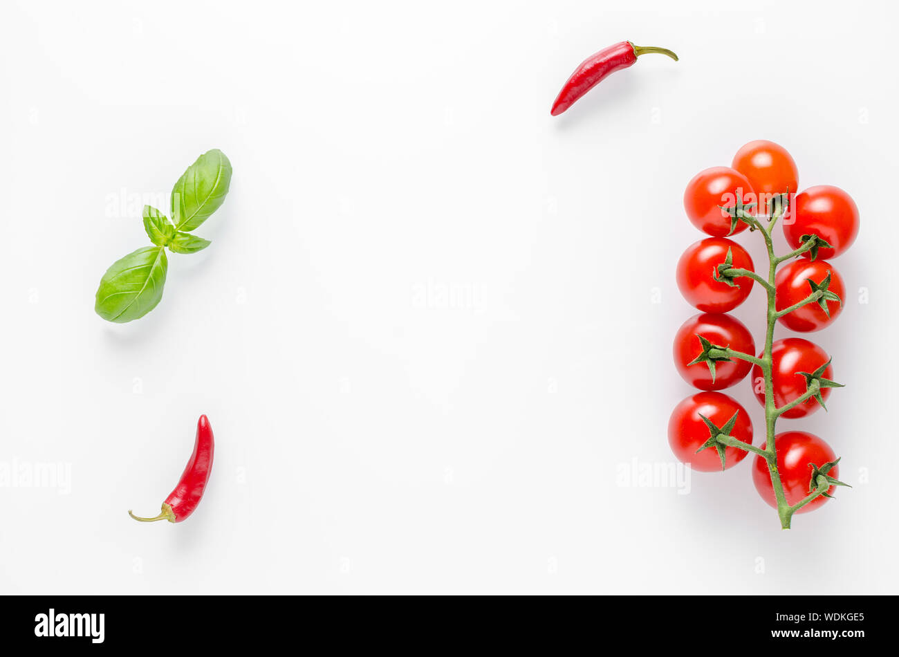 food background with tomato, chili and basilik on white background ...
