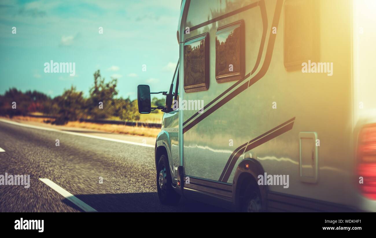 Camper Van Recreational Vehicle Summer Road Trip. Vehicle on a Highway ...