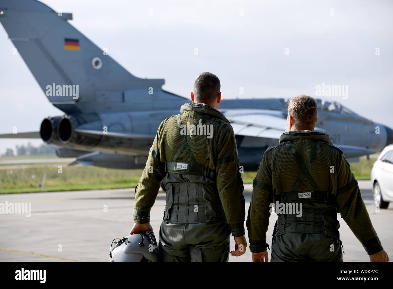 Jagel, Germany. 20th Aug, 2019. Pilots stand at Jagel Air Base in front ...
