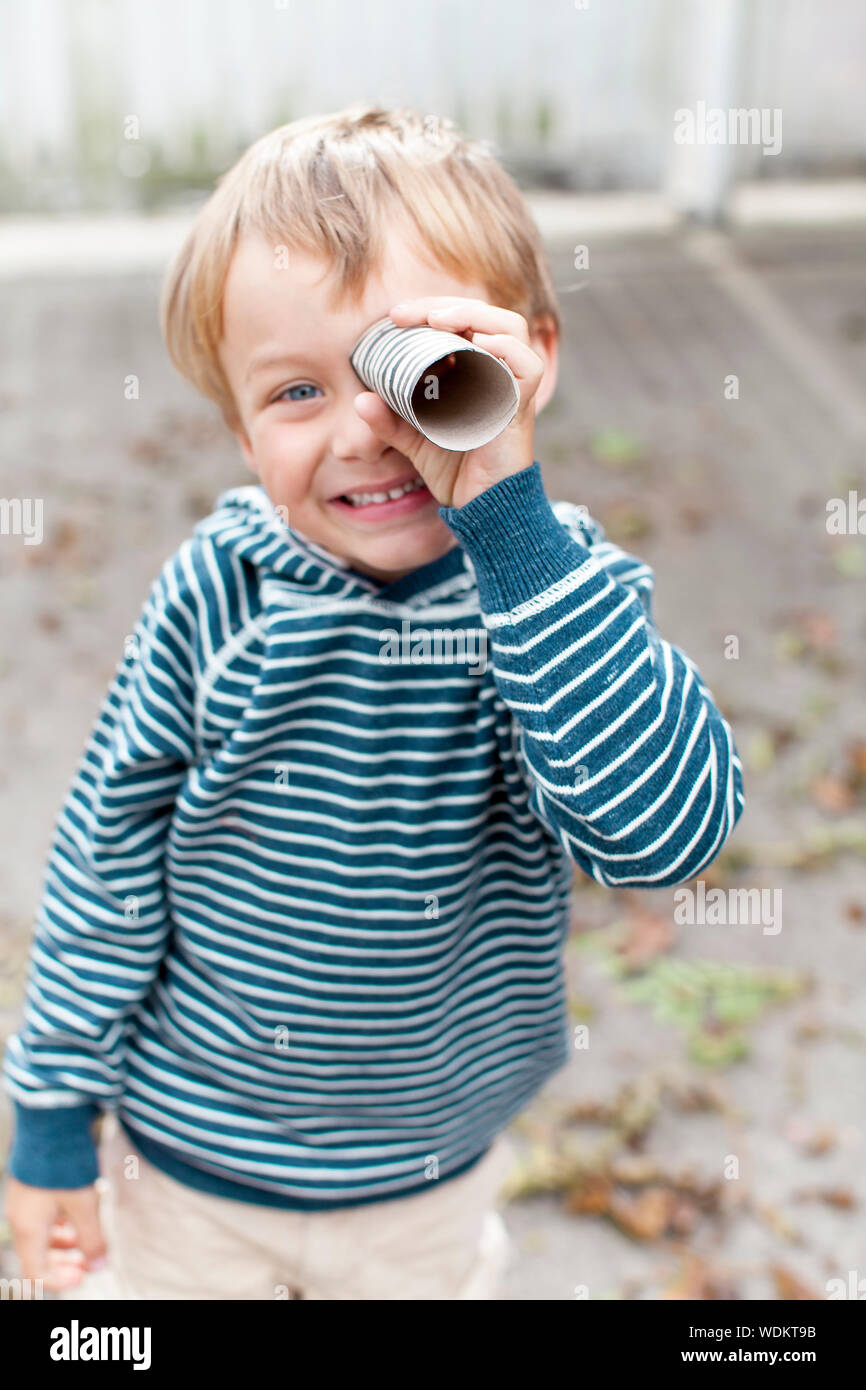 Caucasian boy looking up smiling hi-res stock photography and images ...