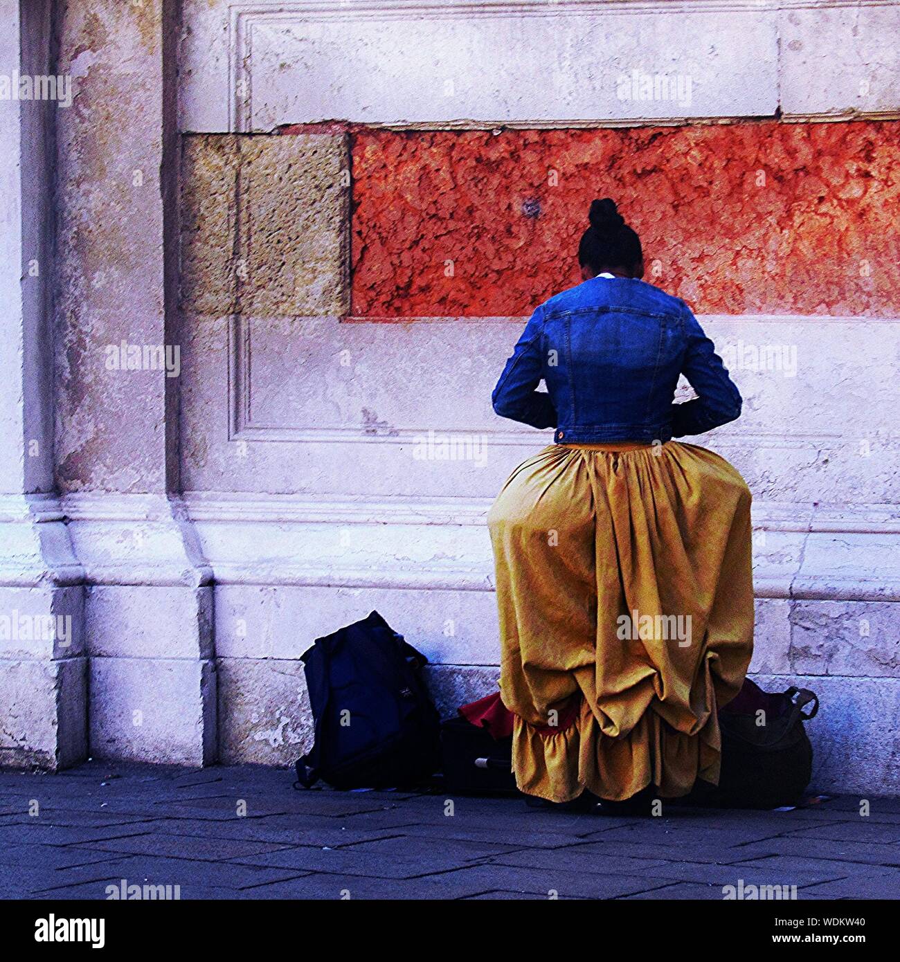 Woman standing looking down, rear view hi-res stock photography and ...