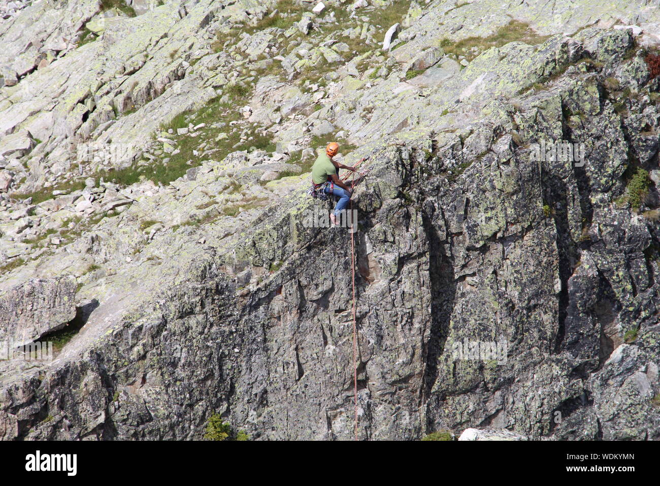 Man Hanging On Cliff High Resolution Stock Photography and Images - Alamy