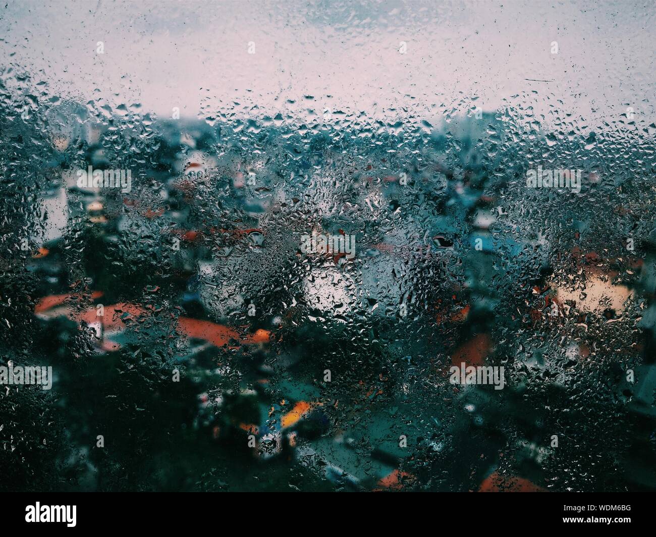 City view through rain window hi-res stock photography and images - Alamy