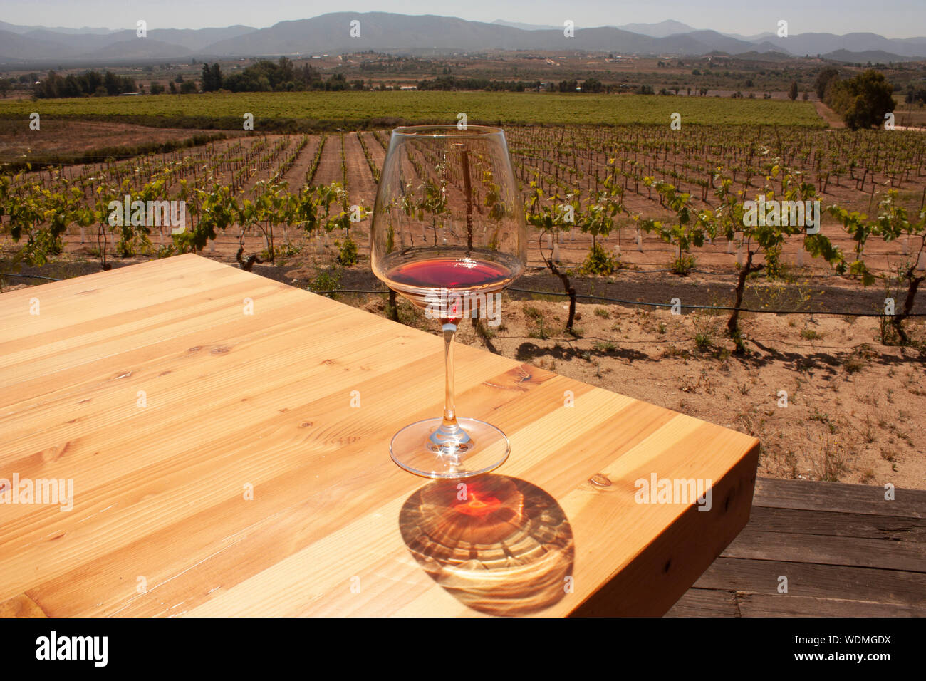Refractive effect of light through a glass cup that shows the wine area ...