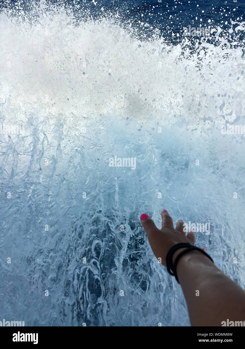 Hand reaching into water hi-res stock photography and images - Alamy