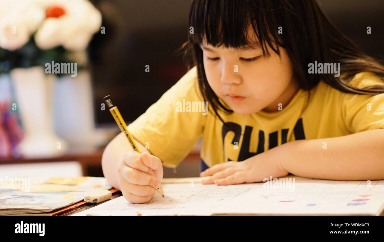 Child writing hi-res stock photography and images - Alamy