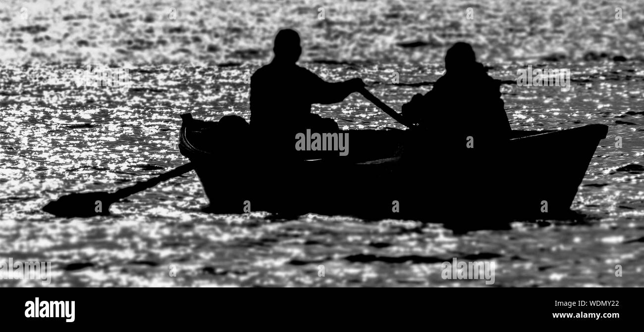 Men in rowing boat Black and White Stock Photos & Images - Alamy