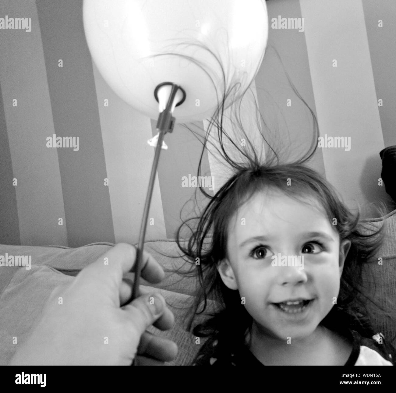 Girl static balloon hair hi-res stock photography and images - Alamy