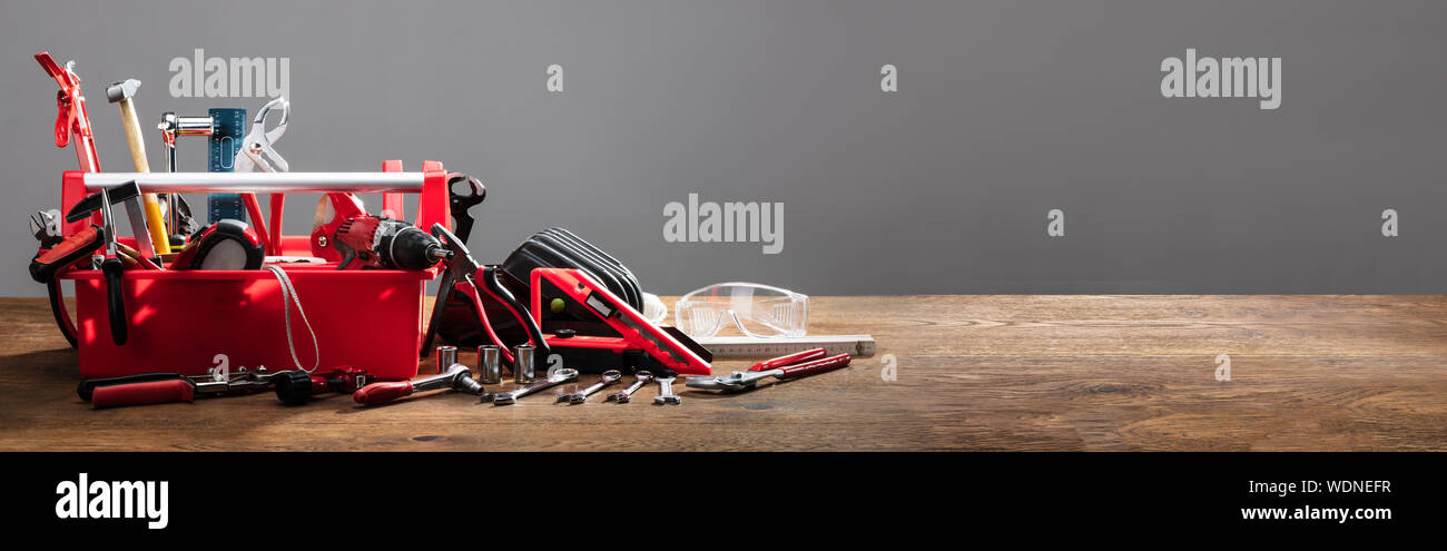 Toolbox With Various Work Tools On Wooden Desk Stock Photo - Alamy