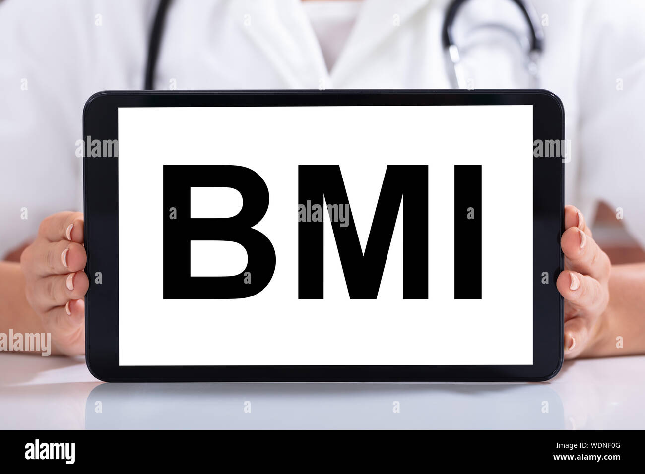 Close-up Of Female Doctor Showing Digital Tablet With Bmi Text Stock ...