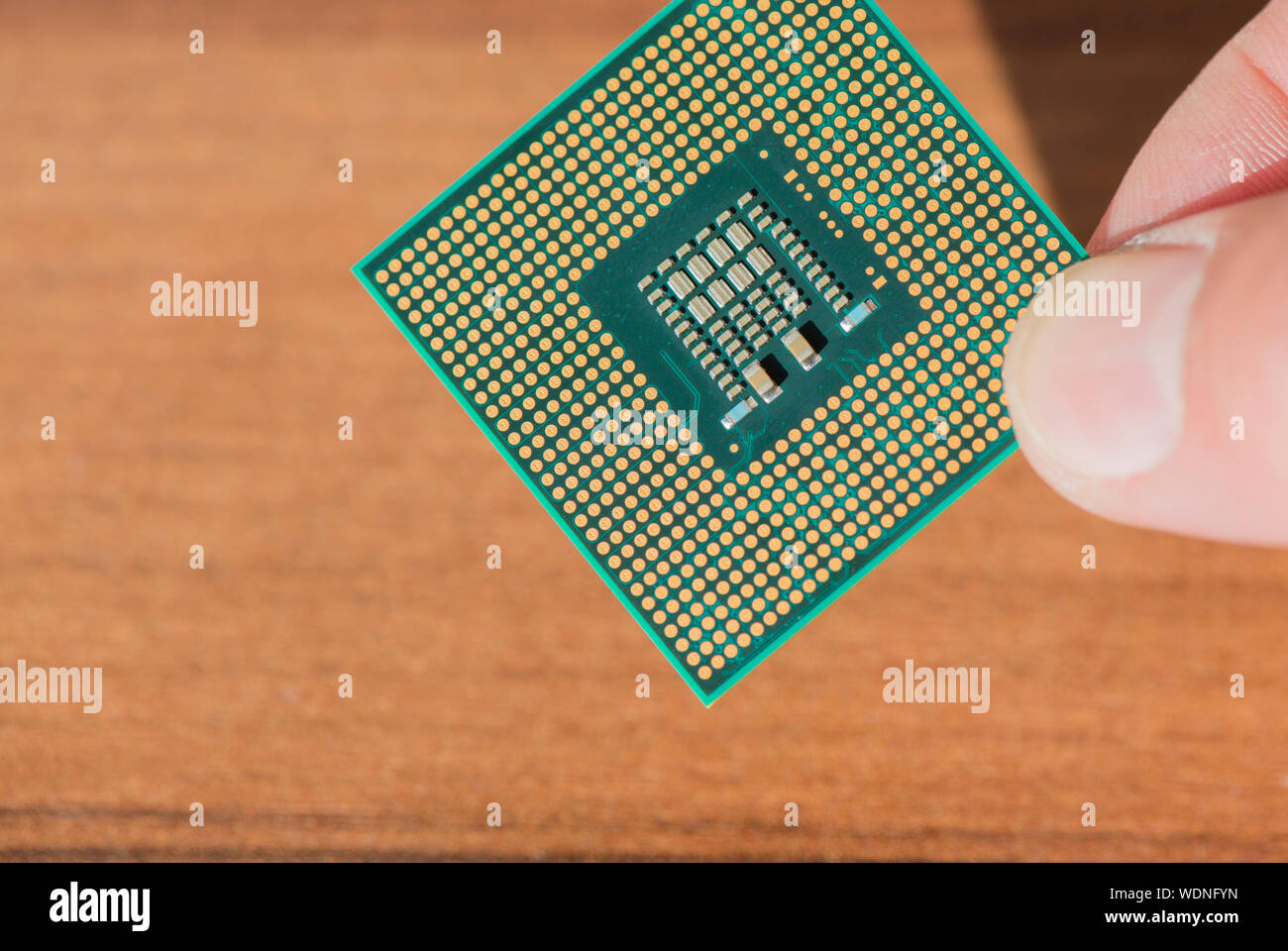 Hand with chip hi-res stock photography and images - Alamy