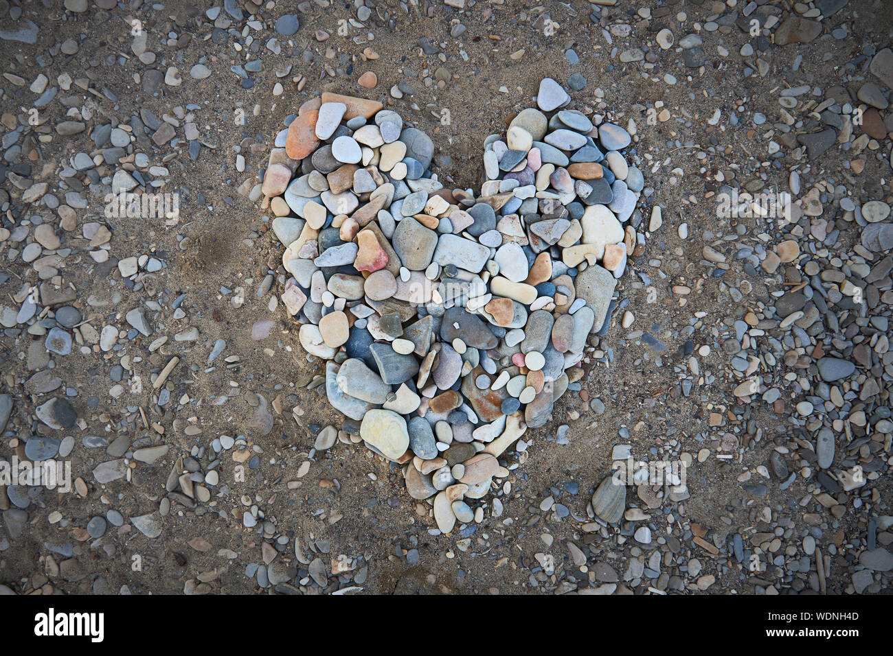 Pebbles in a heart shape hi-res stock photography and images - Alamy
