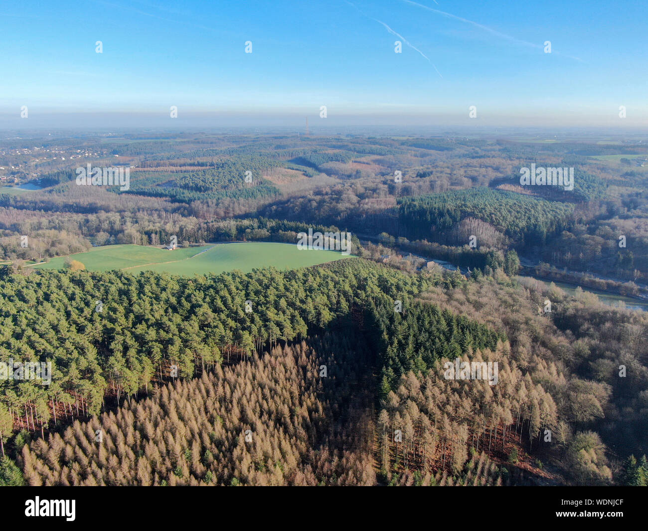 Aerial view of countryside landscape with forests and farmlands during ...