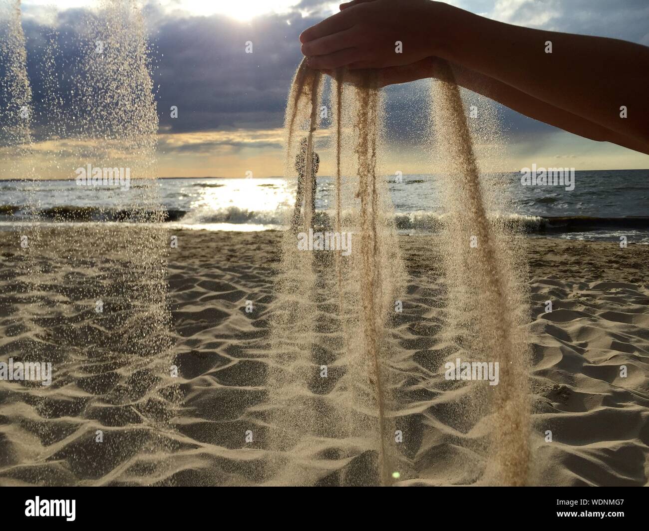 Hand Pouring Sand High Resolution Stock Photography and Images - Alamy