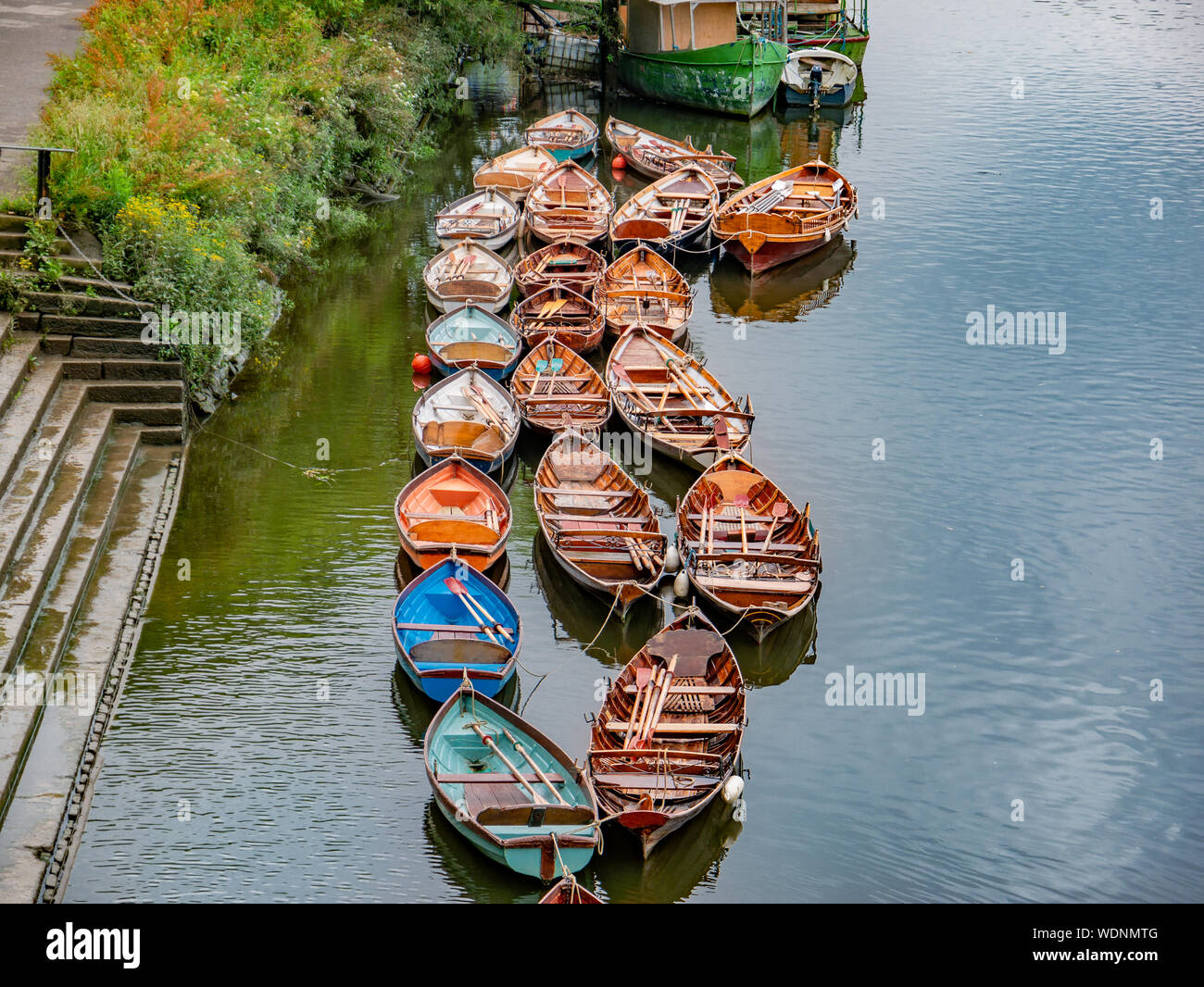 Wooden traditional boats on the riverside of the Thames river in ...