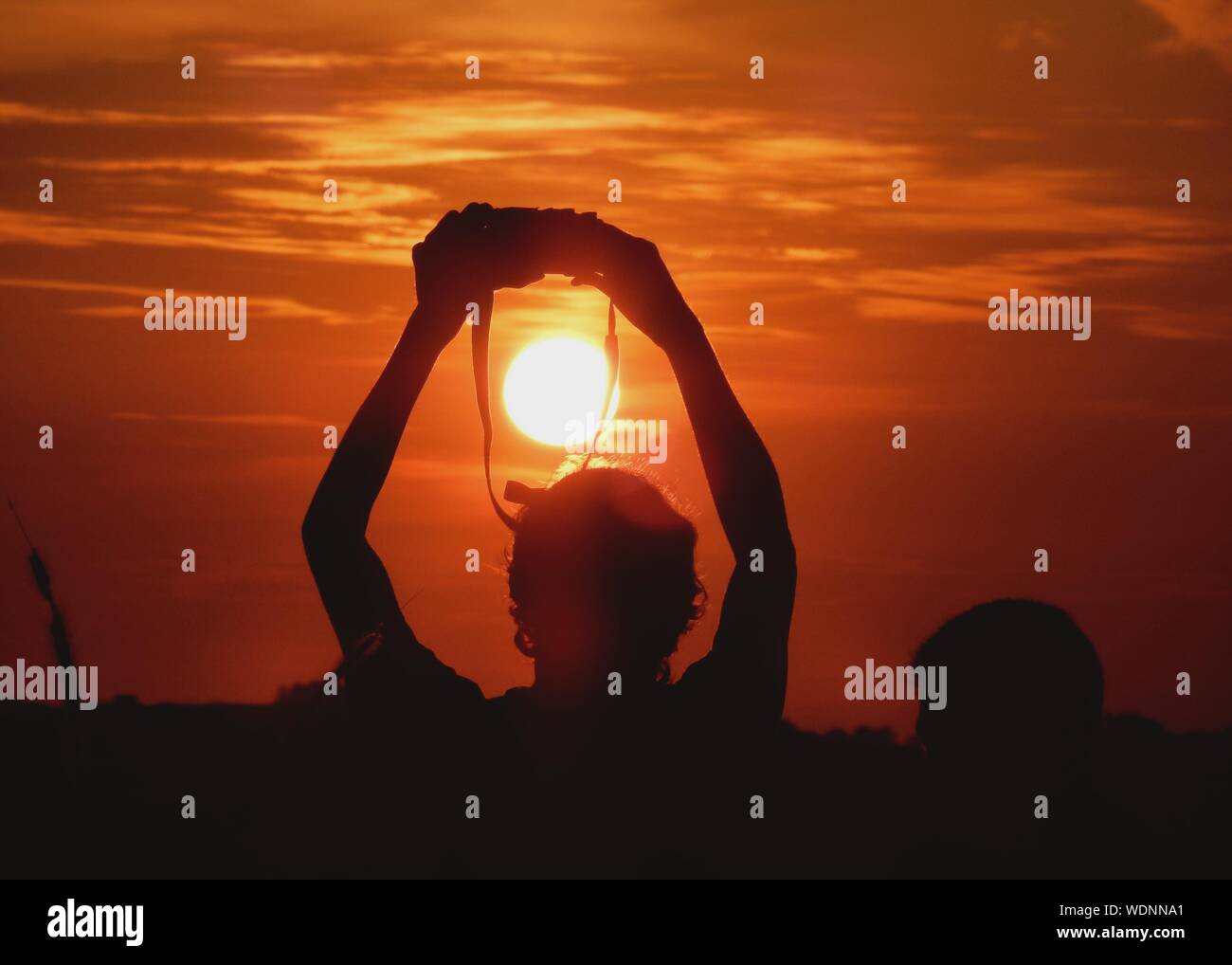 Silhouette Of Sun During Sunset Stock Photo - Alamy