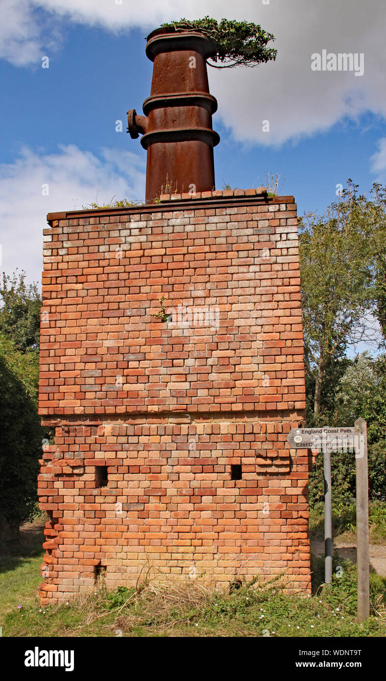 An old red brick retort for oil extraction at Kilve beach, near East ...