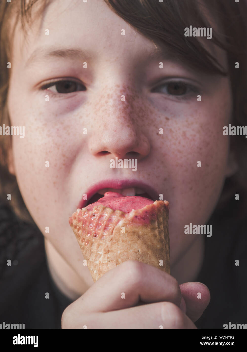 Boy licking an ice cream hi-res stock photography and images - Alamy