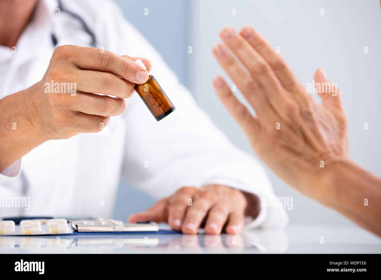 Medication pills two persons hi-res stock photography and images - Alamy