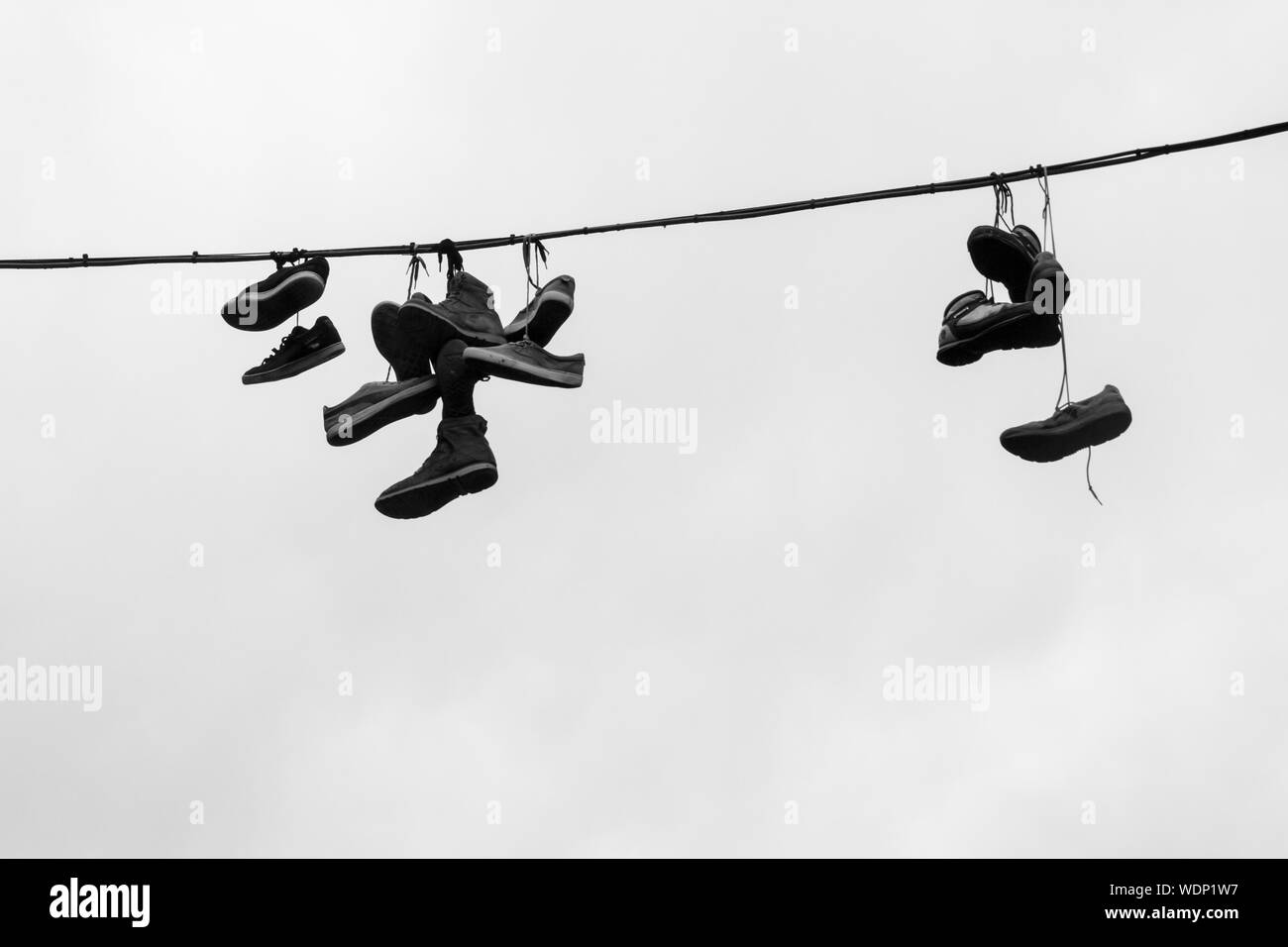 Shoes Hanging From Cable High Resolution Stock Photography and Images ...