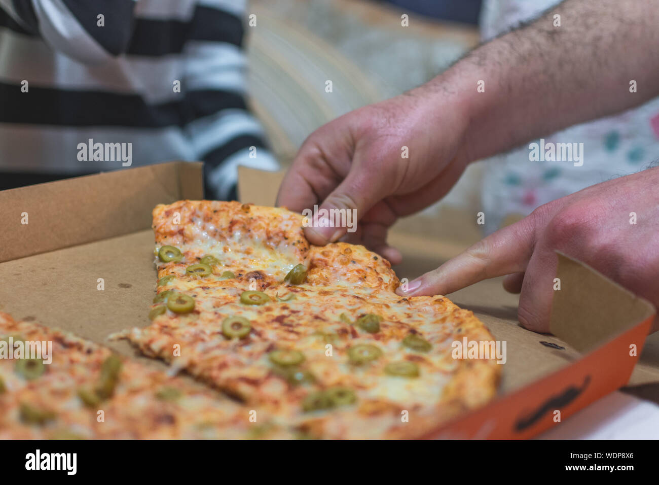 Hand Taking Pizza Slice High Resolution Stock Photography and Images ...