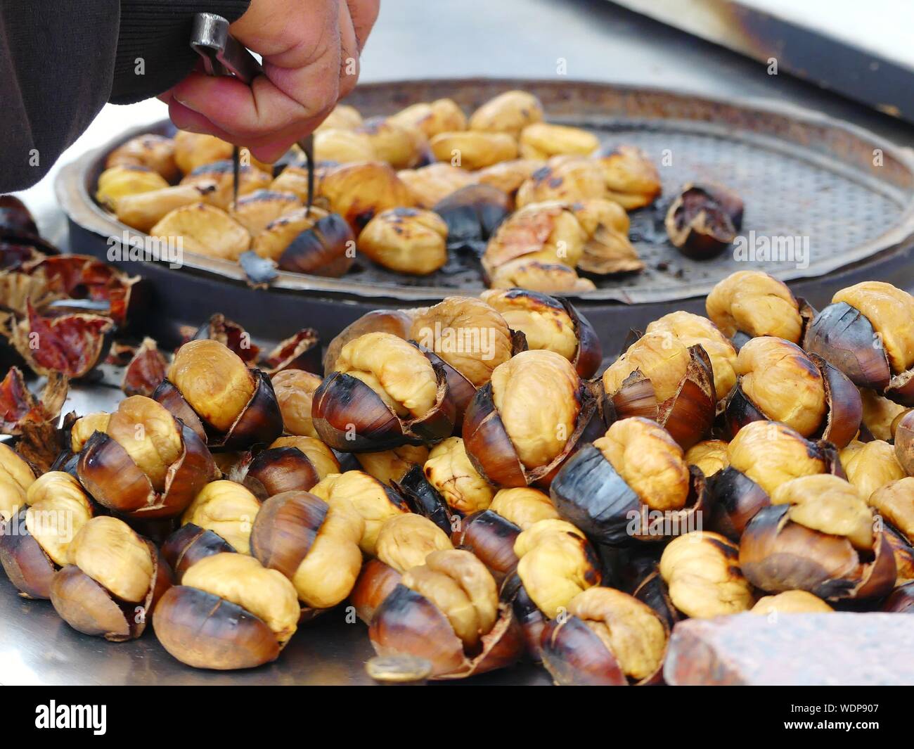 Man Roasting Chestnuts High Resolution Stock Photography and Images - Alamy