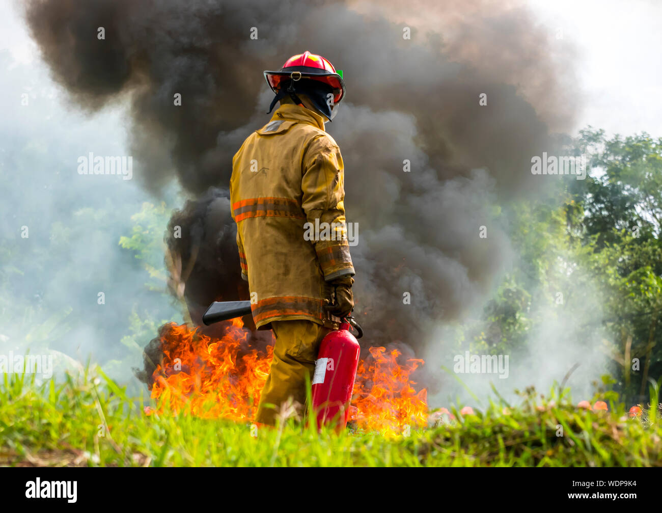 Man fire extinguishing hi-res stock photography and images - Alamy