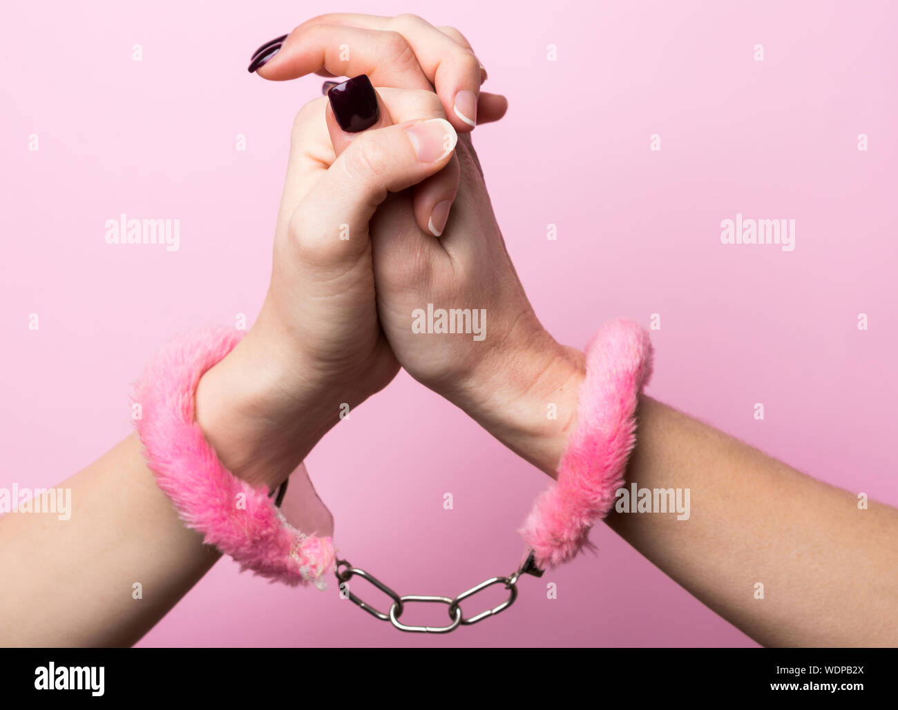 Woman with handcuffs hi-res stock photography and images - Alamy