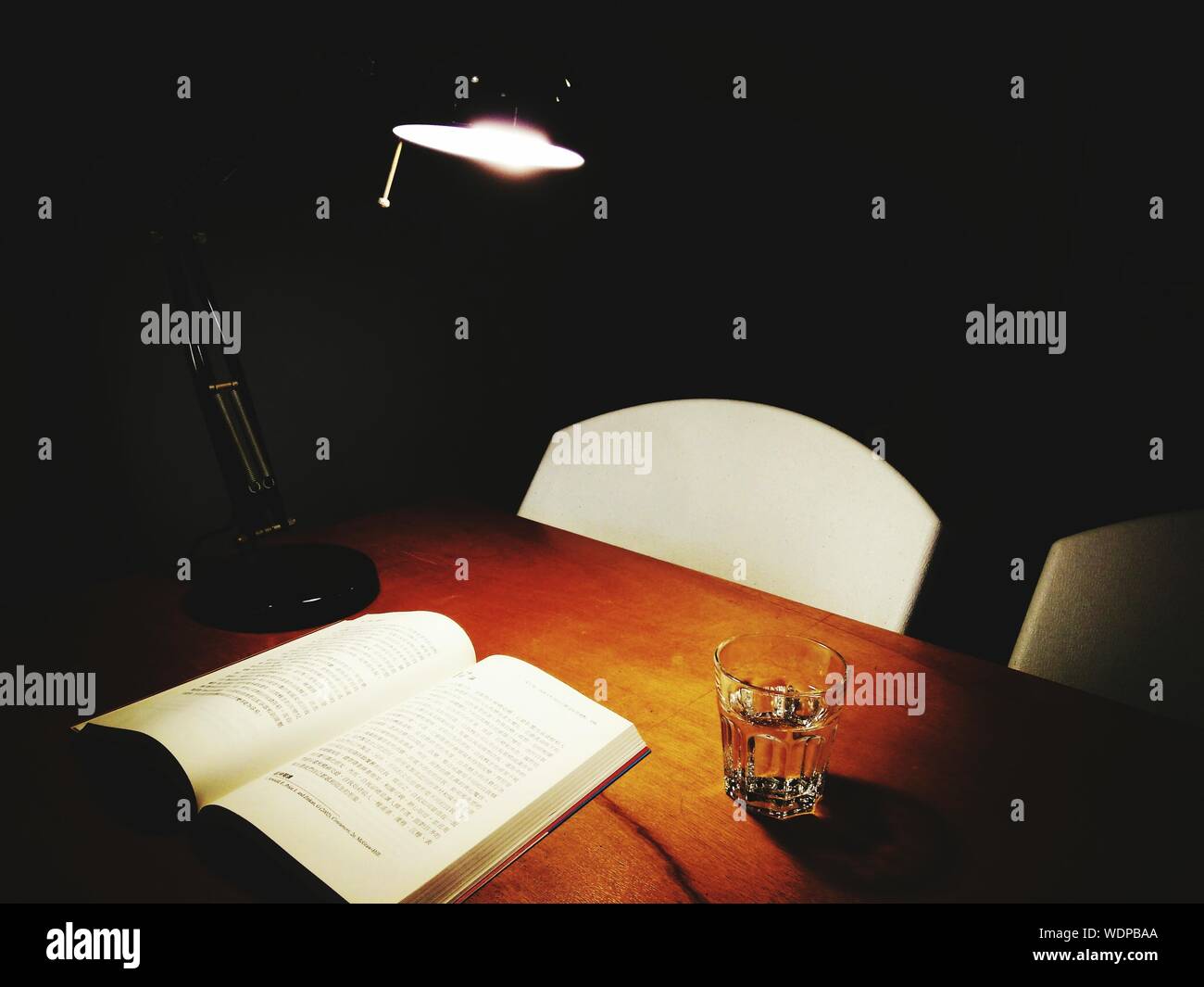 Book under table hi-res stock photography and images - Alamy