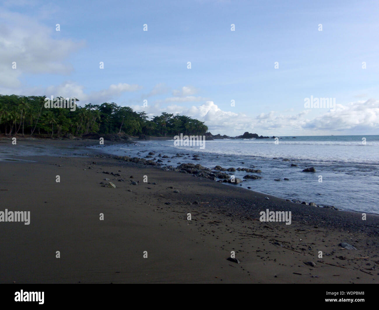 Waves roll into shore at Rocky Beach in Punta Banco, Costa Rica on the ...