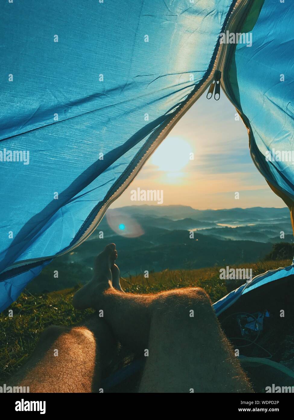 Man camping tent in sunset hi-res stock photography and images - Alamy