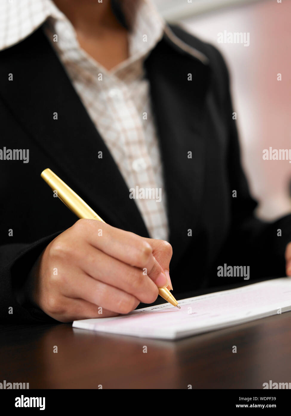 Hand Signing Check Stock Photos & Hand Signing Check Stock Images - Alamy