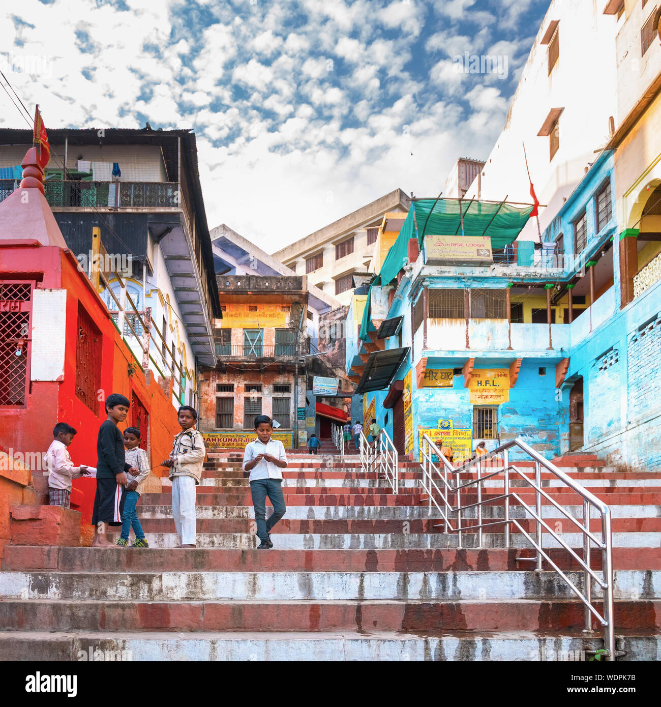 Young Indian boys playing on the steps of the Ganges River in Varanasi ...
