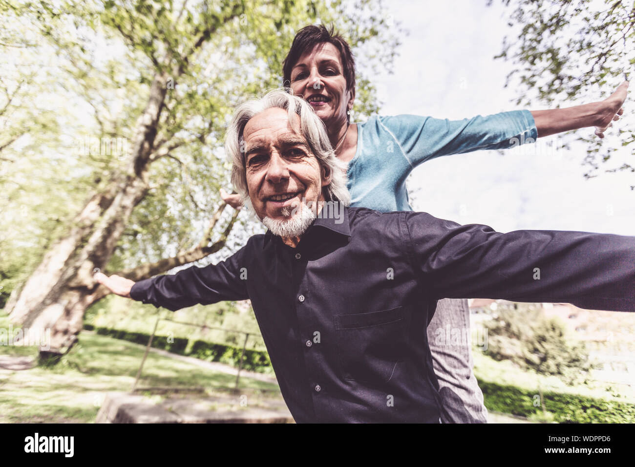 Woman carrying man on back hi-res stock photography and images - Alamy