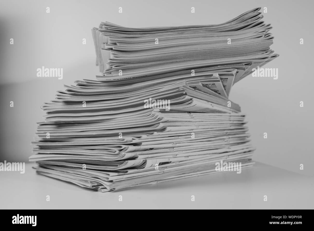Stack Of Papers On Table Against White Background Stock Photo - Alamy