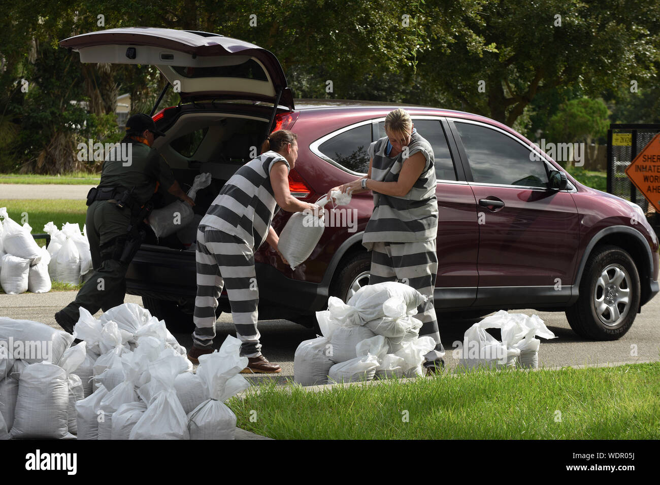 Titusville, FL, USA. 29th Aug, 2019. A supervised work crew of female ...
