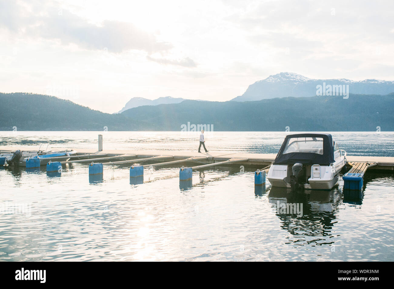 Man walking on jetty hi-res stock photography and images - Alamy