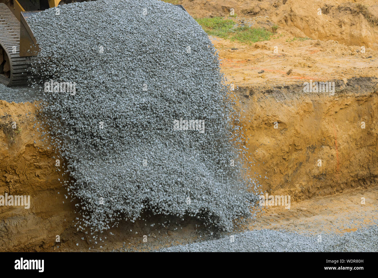 Building foundation work at the construction site stone backfill ...
