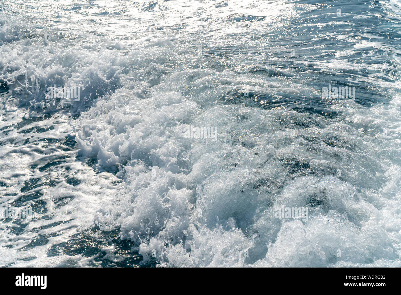 Closeup of wave traces on the blue ocean surface with copy space Stock ...