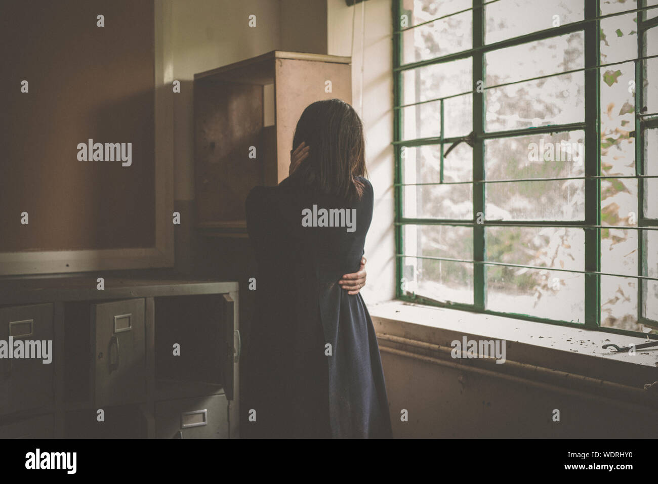 Women hugging rear view hi-res stock photography and images - Alamy