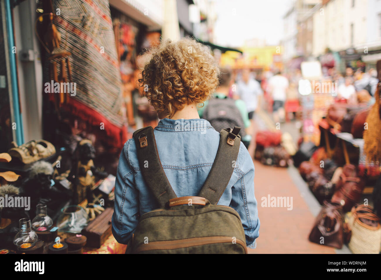 People walking through market stalls hi-res stock photography and ...