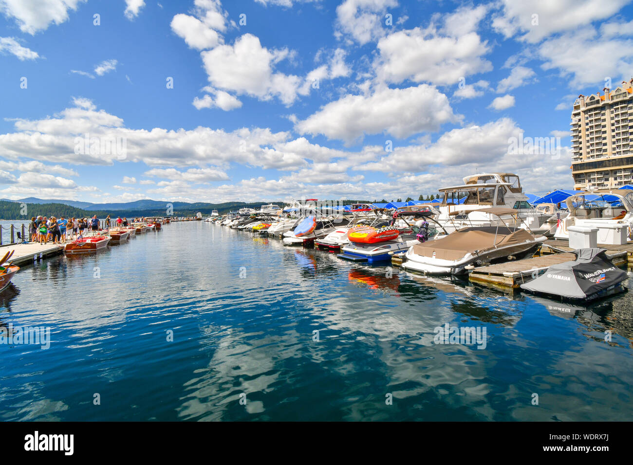 Tourists and locals spend a summer afternoon at the Wooden Boat Show on ...