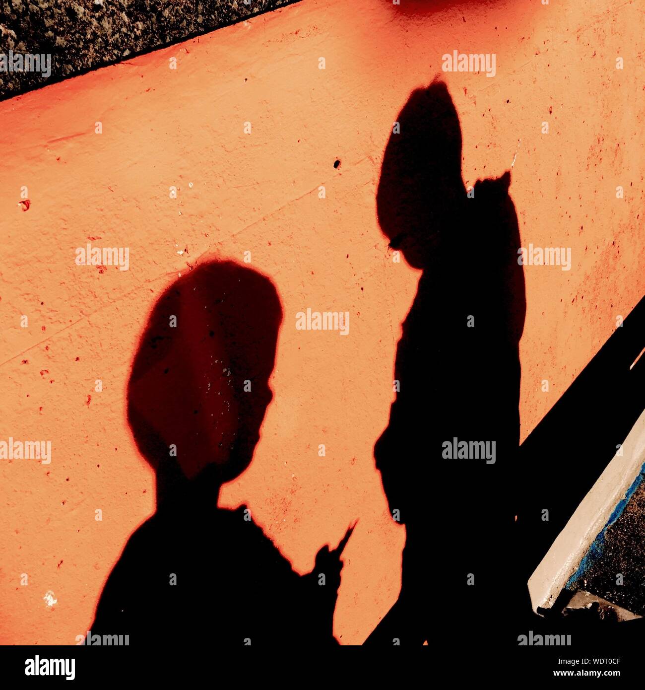 Two people standing shadows hi-res stock photography and images - Alamy