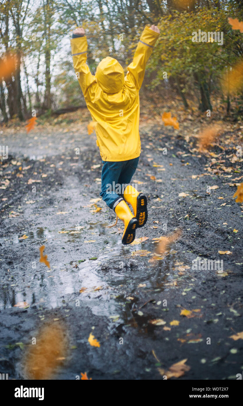 Boy Jumping In Puddle High Resolution Stock Photography and Images - Alamy