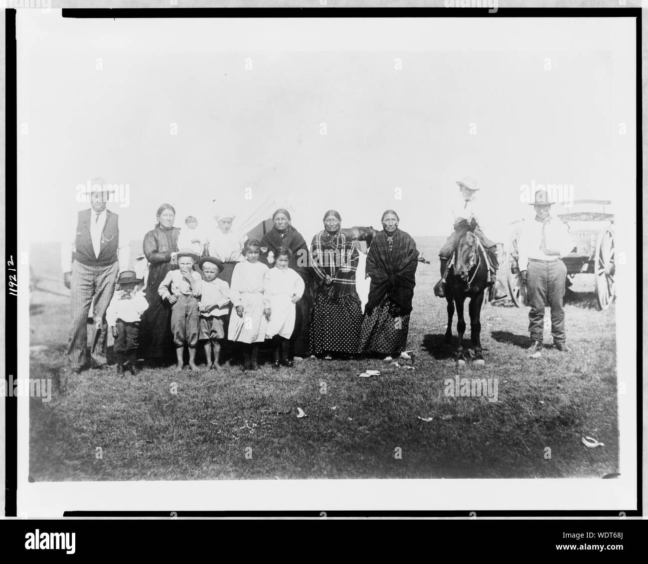 Group of Kickapoo Indians, standing outside tent, dressed in Euro ...