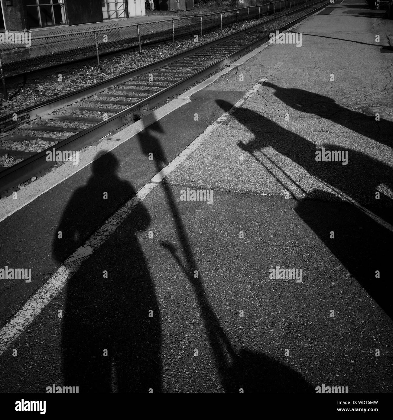 Three men on platform Black and White Stock Photos & Images - Alamy