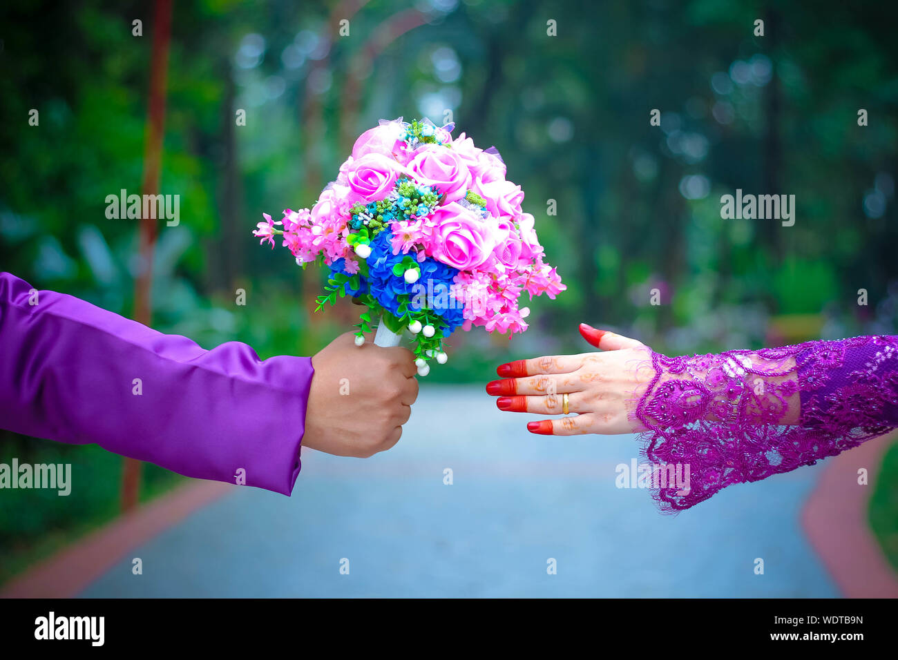 Giving bouquet hi-res stock photography and images - Alamy