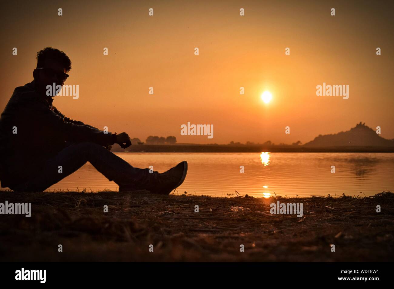 Sitting bank side hi-res stock photography and images - Alamy