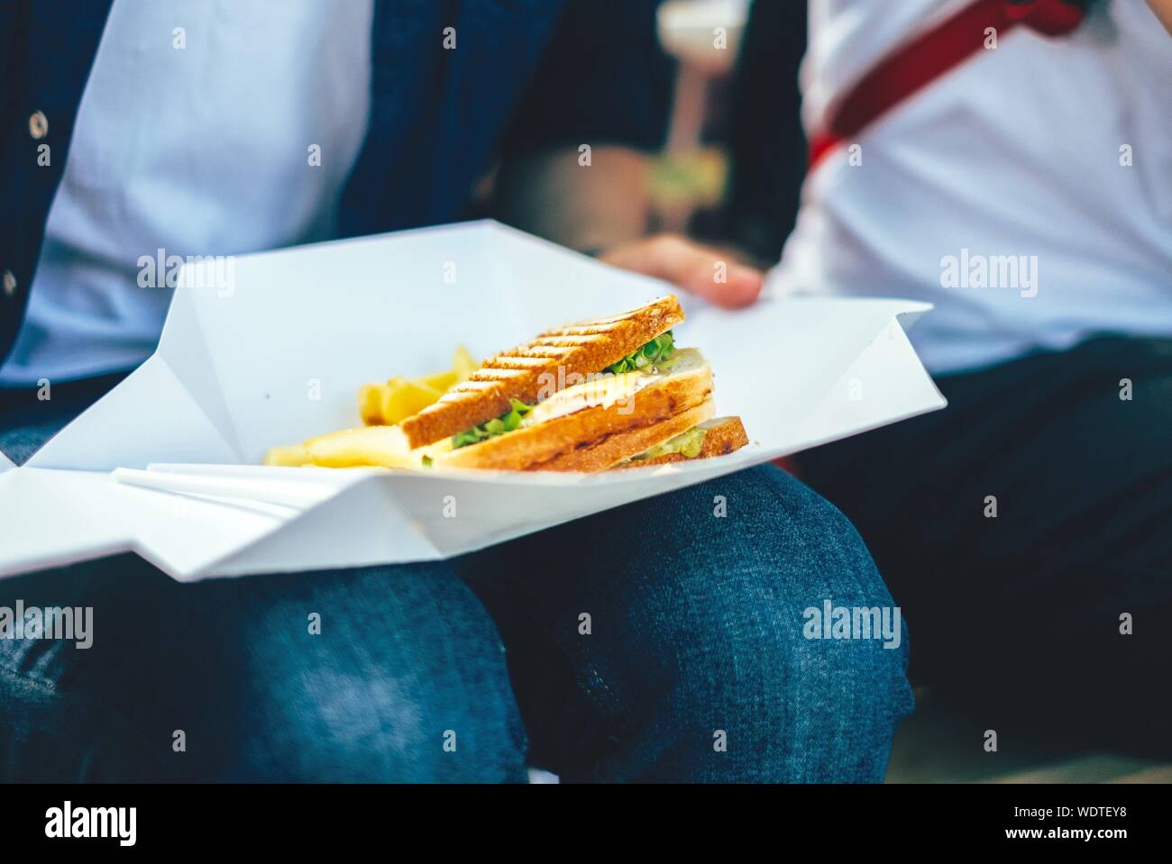 Person eating sandwich hi-res stock photography and images - Alamy