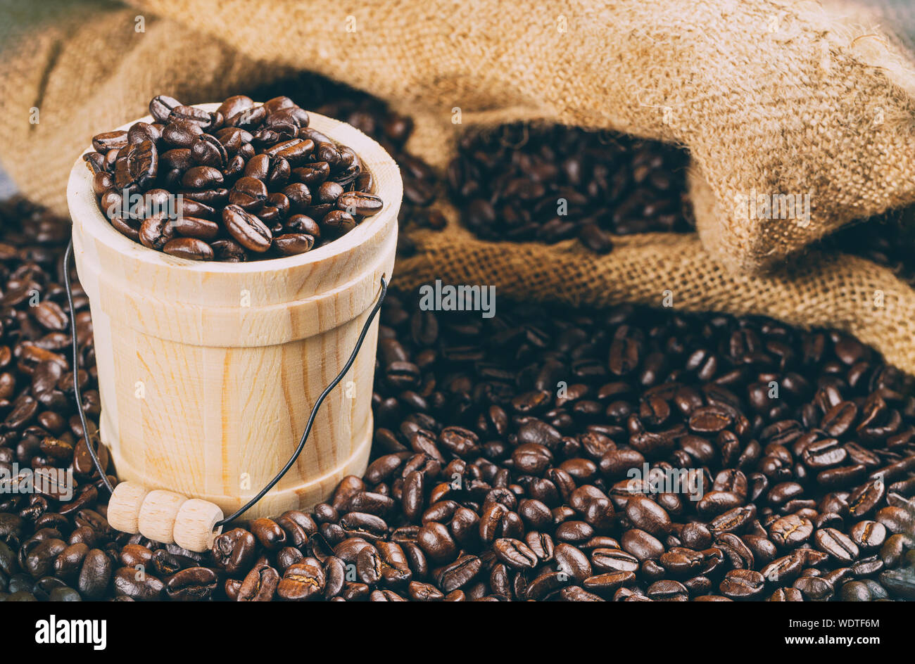 Coffee of roasted beans in a bucket on a roasted coffee beans ...